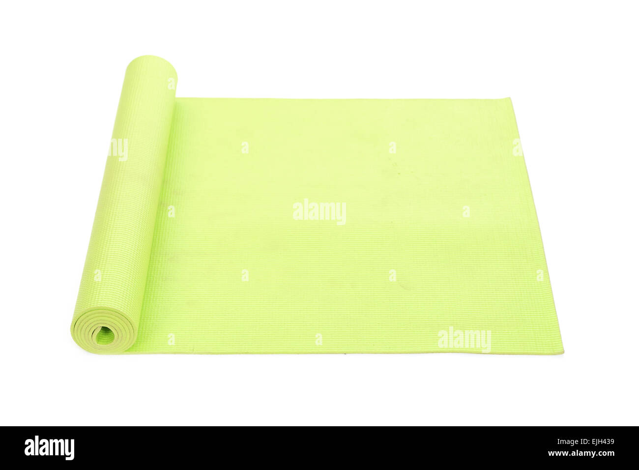 green yoga mat on a white background Stock Photo - Alamy