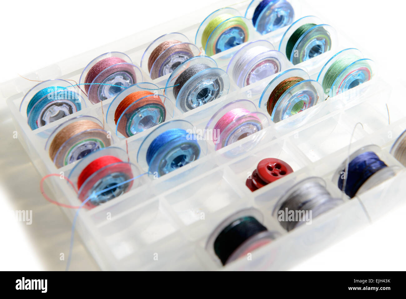 a plurality of thread bobbins for sewing machine in plastic box Stock ...