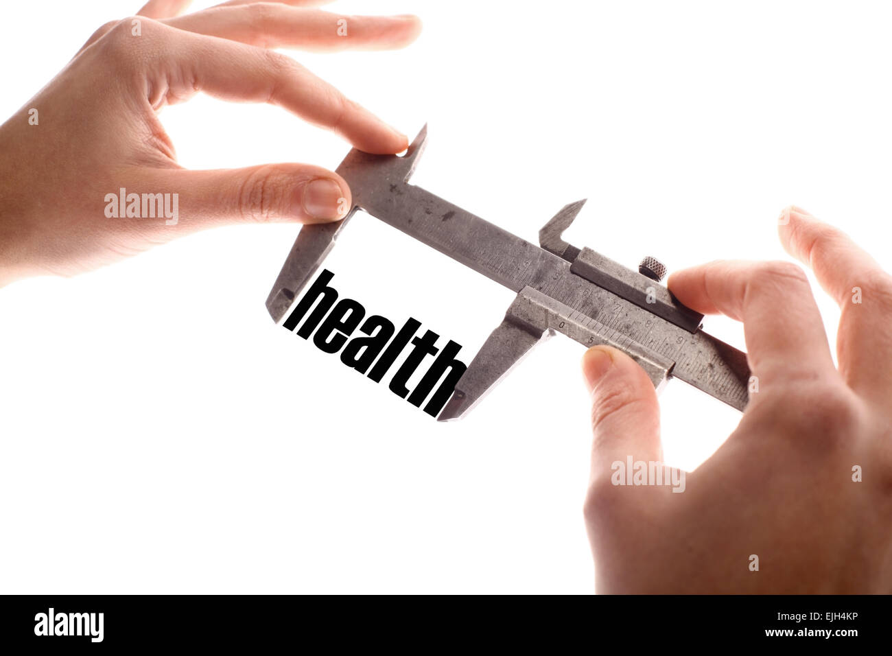 Color horizontal shot of two hands holding a caliper and measuring the ...