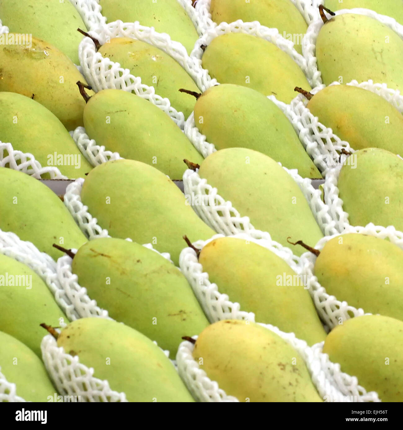 Pile of mango on market tray Stock Photo - Alamy