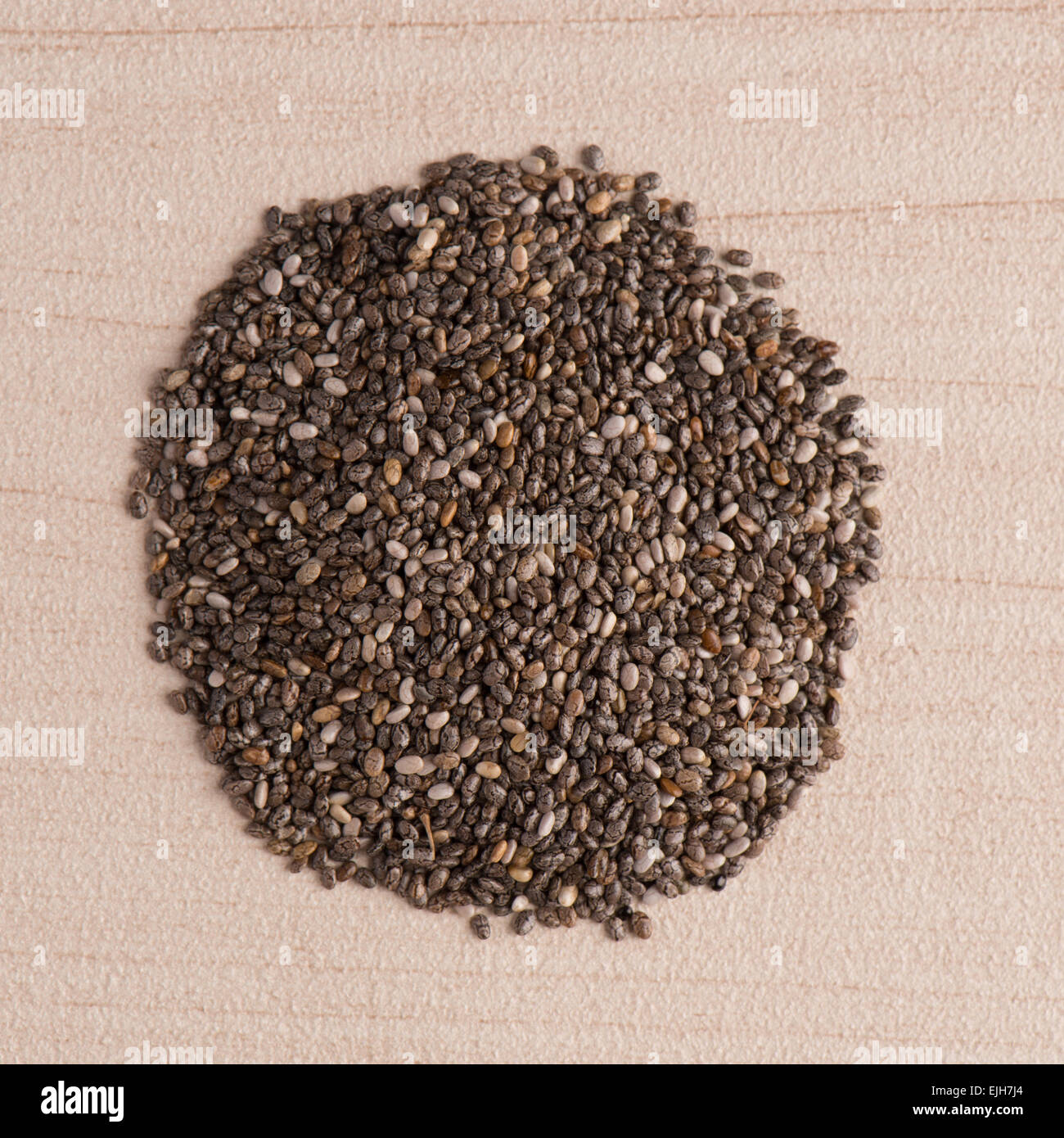 Top view of chia seeds against beige vinyl background Stock Photo - Alamy