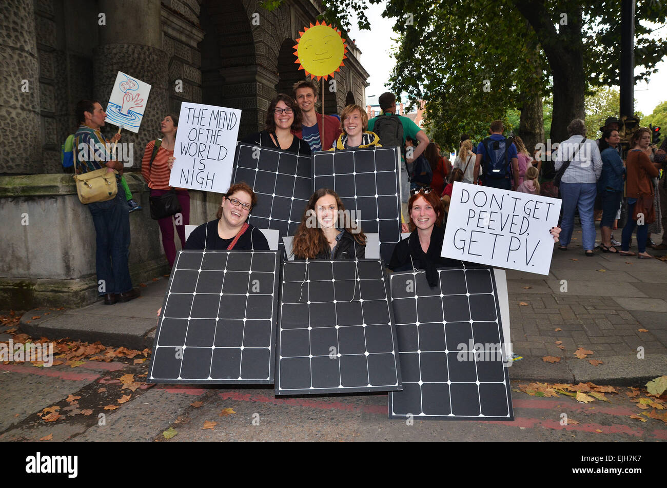 Demonstrators display placards and banners as they participate in the ...