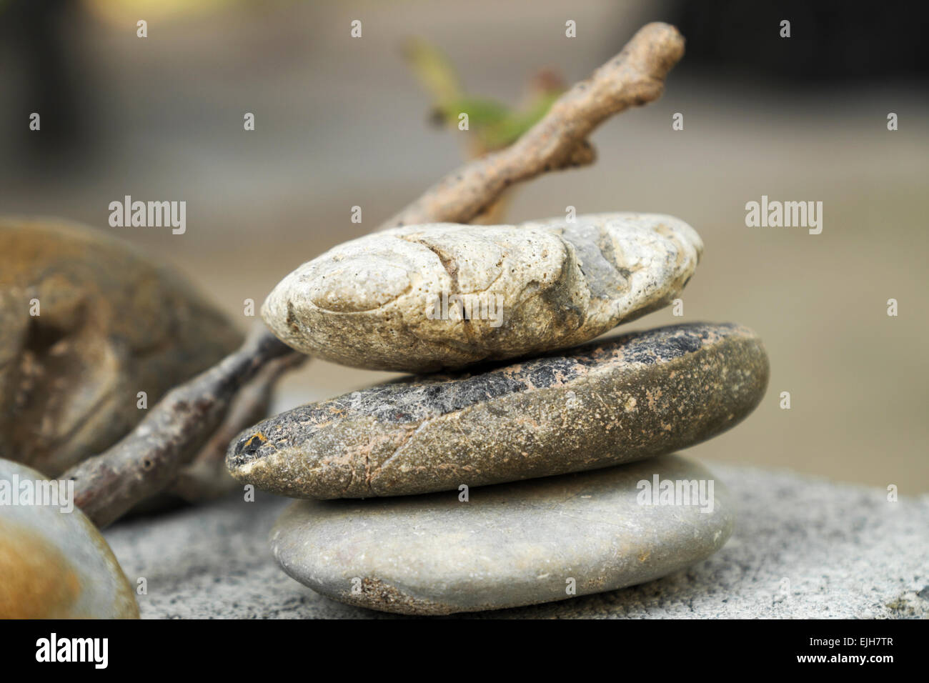 Stacked stones in a simulated Japanese garden Stock Photo - Alamy