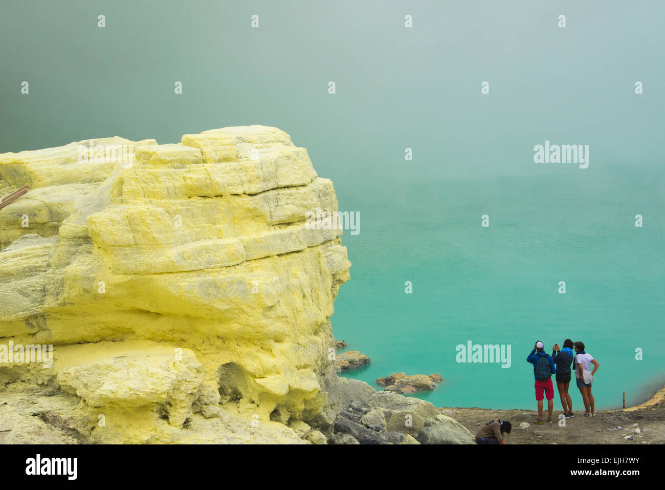Tourists with sulfur rock at Ijen Crater, East Java, Indonesia Stock ...
