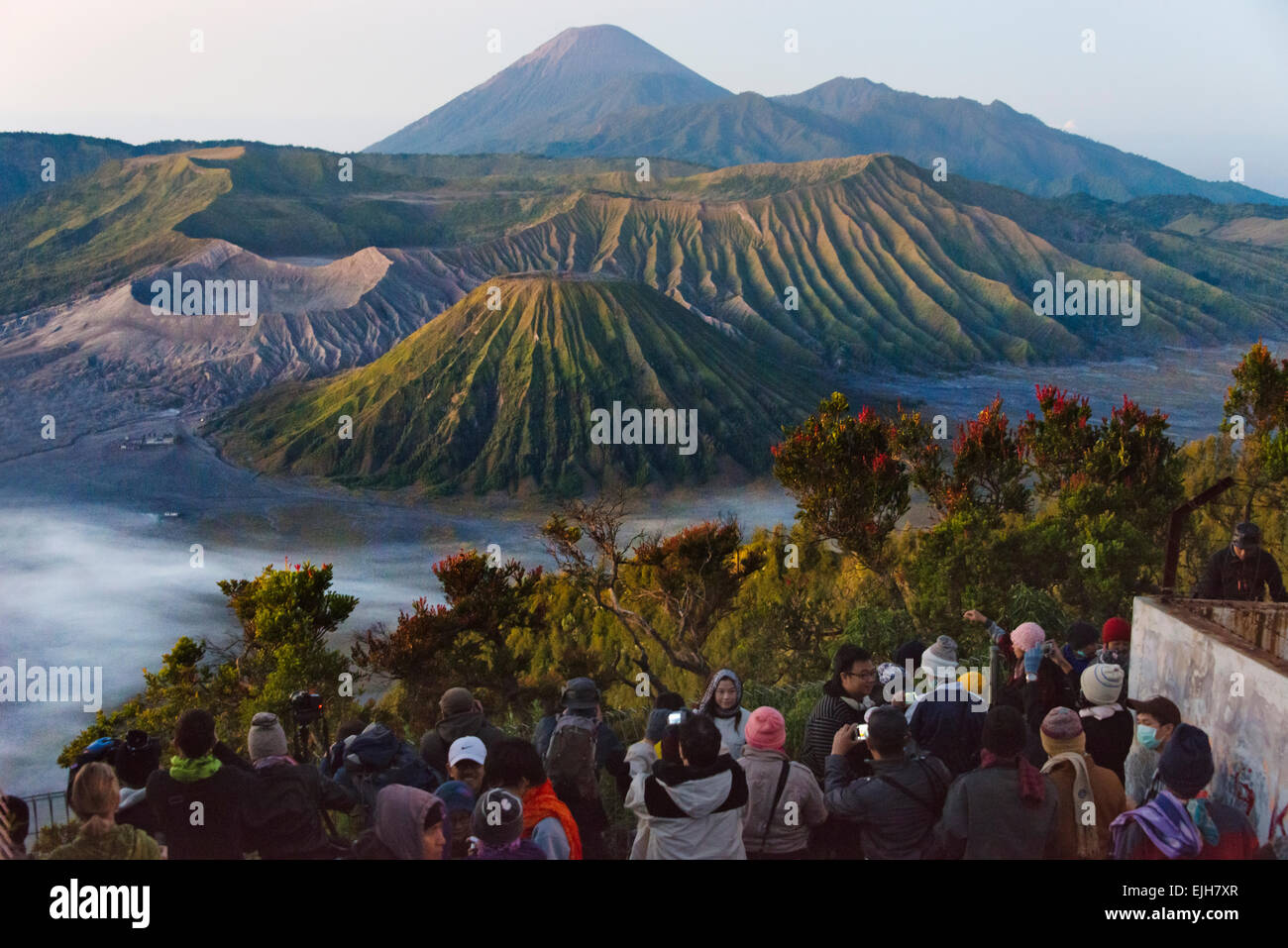 Tourists photographing sunrise at dawn, Bromo Tengger Semeru National ...