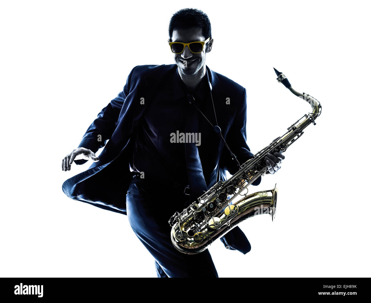 one caucasian man saxophonist playing saxophone player in studio ...