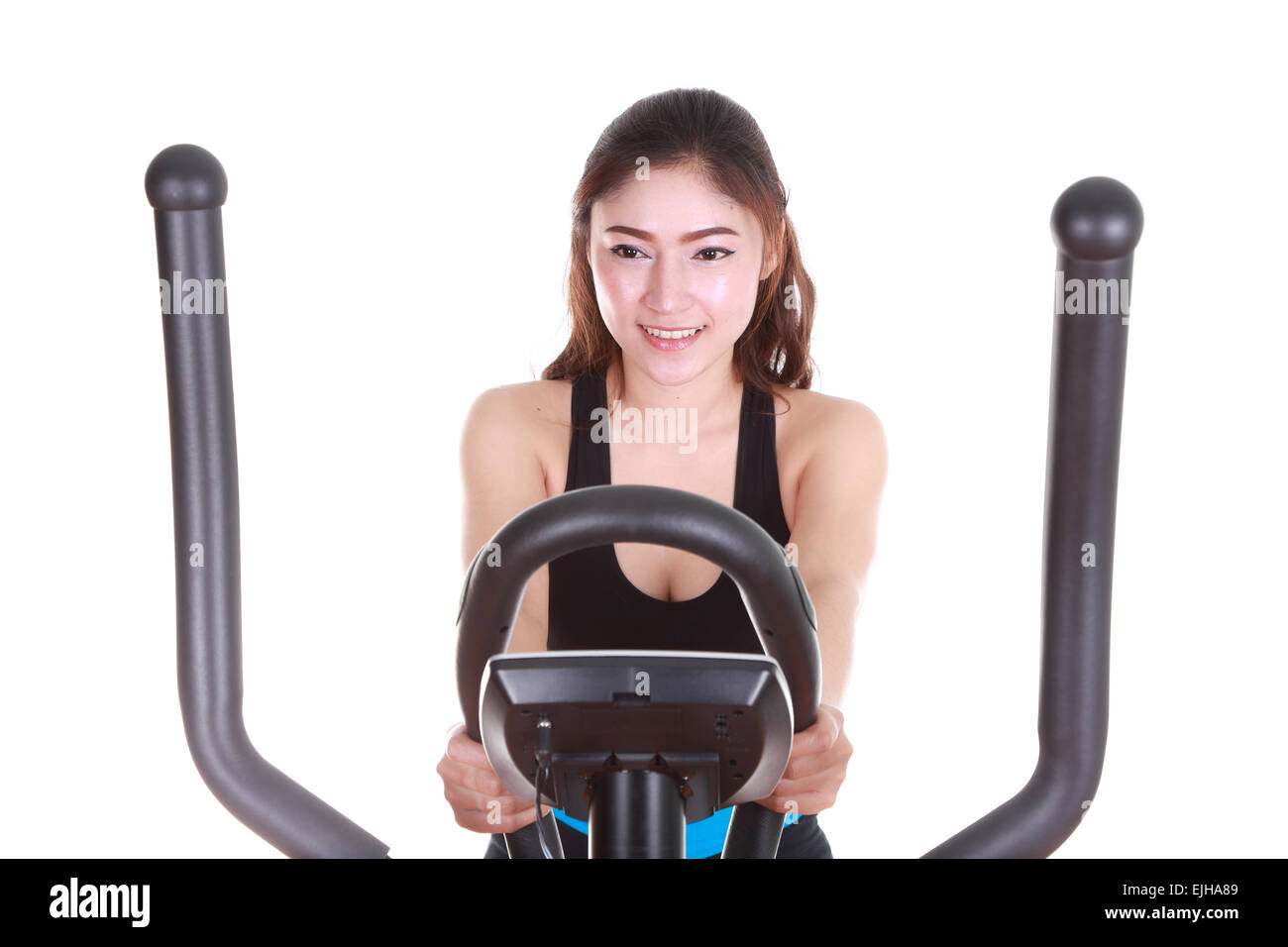 young woman doing exercises with exercise machine, on white background ...