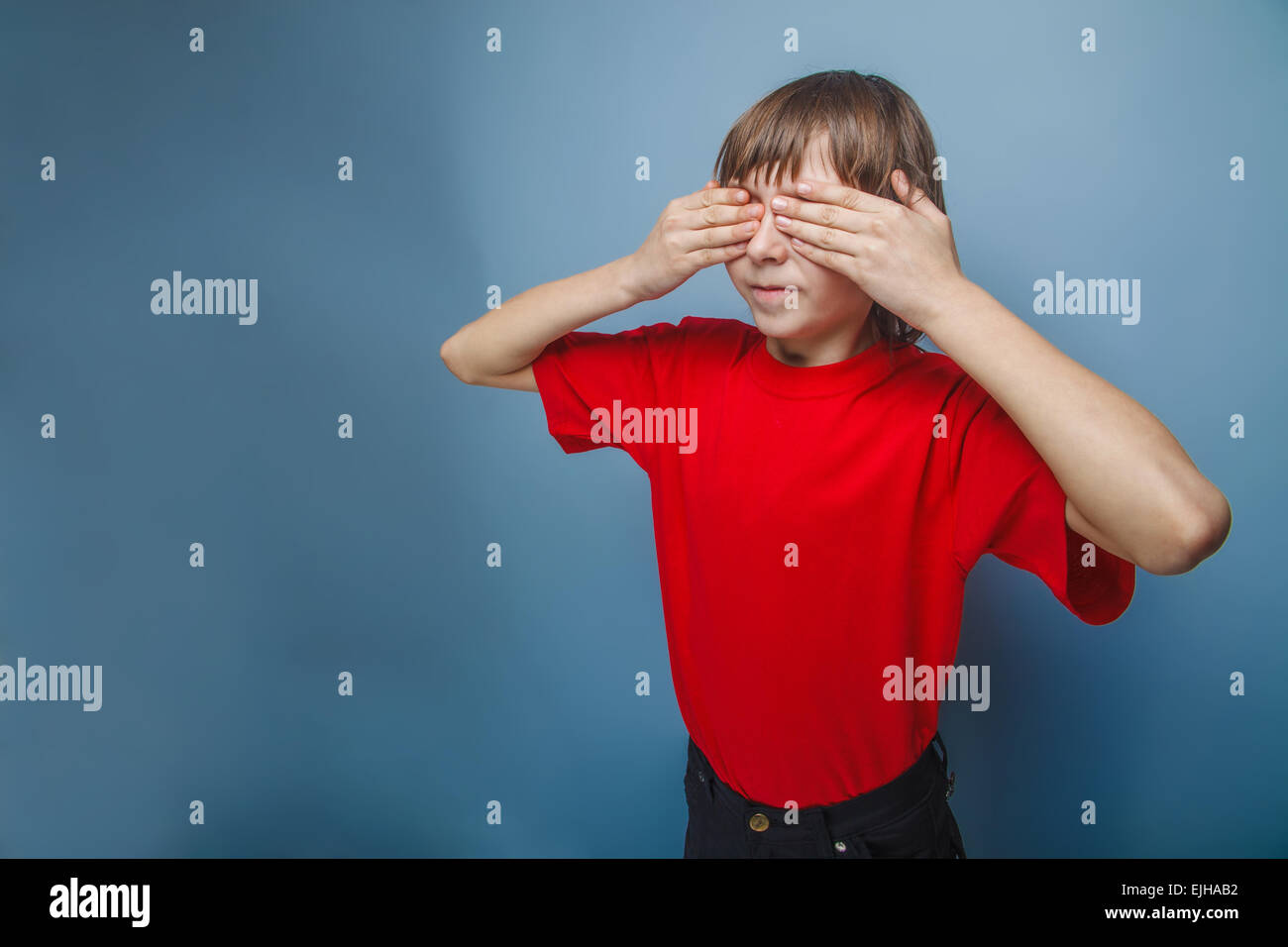boy in red t-shirt teenager brown hair European appearance eyes Stock ...
