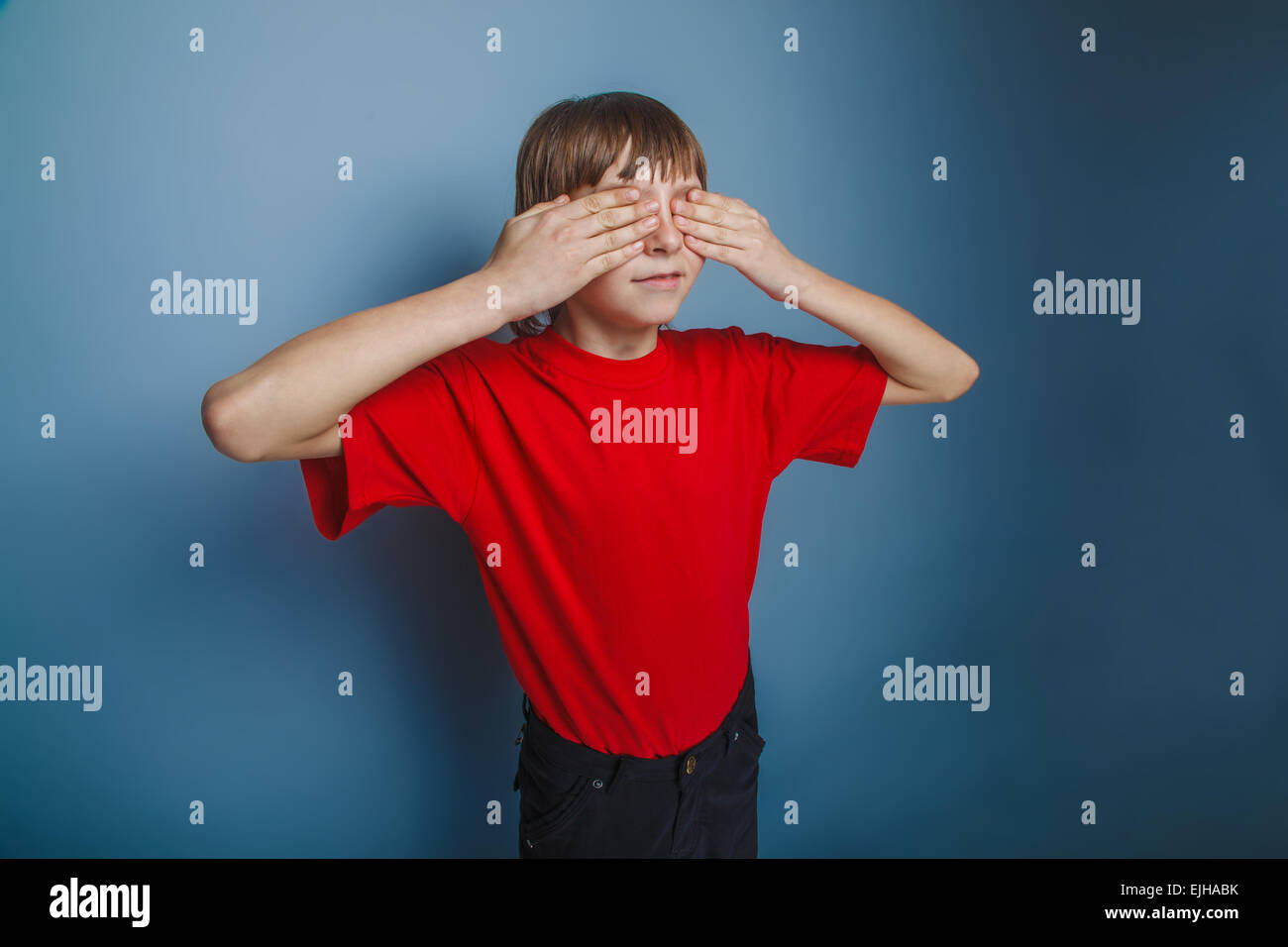 boy in red t-shirt teenager brown hair European appearance eyes Stock ...