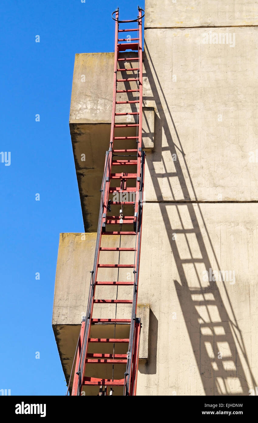 Ladder next to a wall of a building Stock Photo - Alamy
