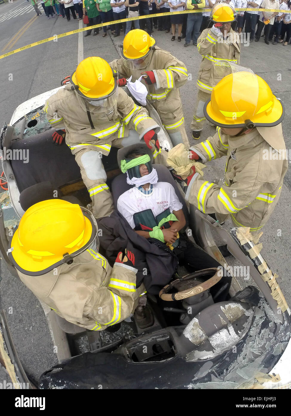 Marikina City, Philippines. 27th Mar, 2015. Firefighters rescue a mock ...