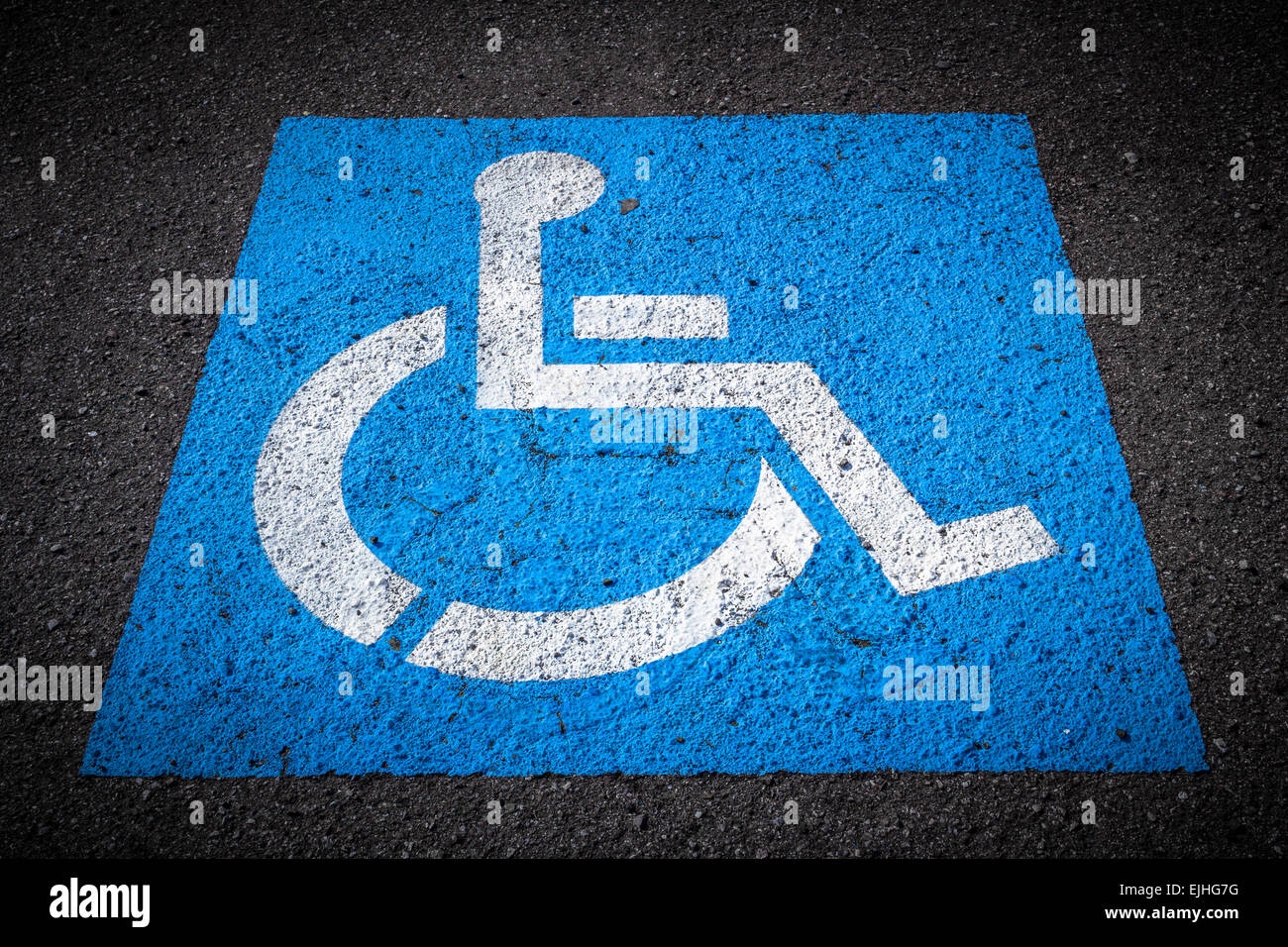 Indication of reserved seat for disabled parking Stock Photo - Alamy