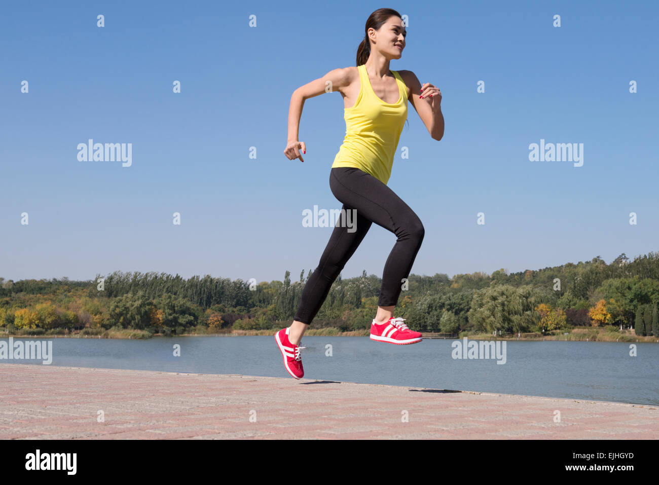 Woman jogging low angle hi-res stock photography and images - Alamy