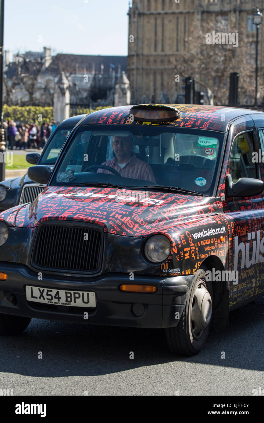 London cab with advertising, London, England Stock Photo - Alamy