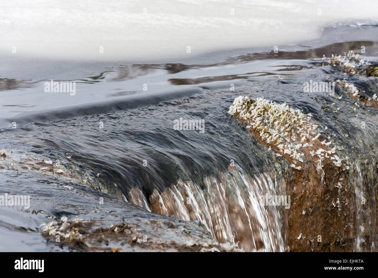 Emanating from the ice water is falling down Stock Photo - Alamy