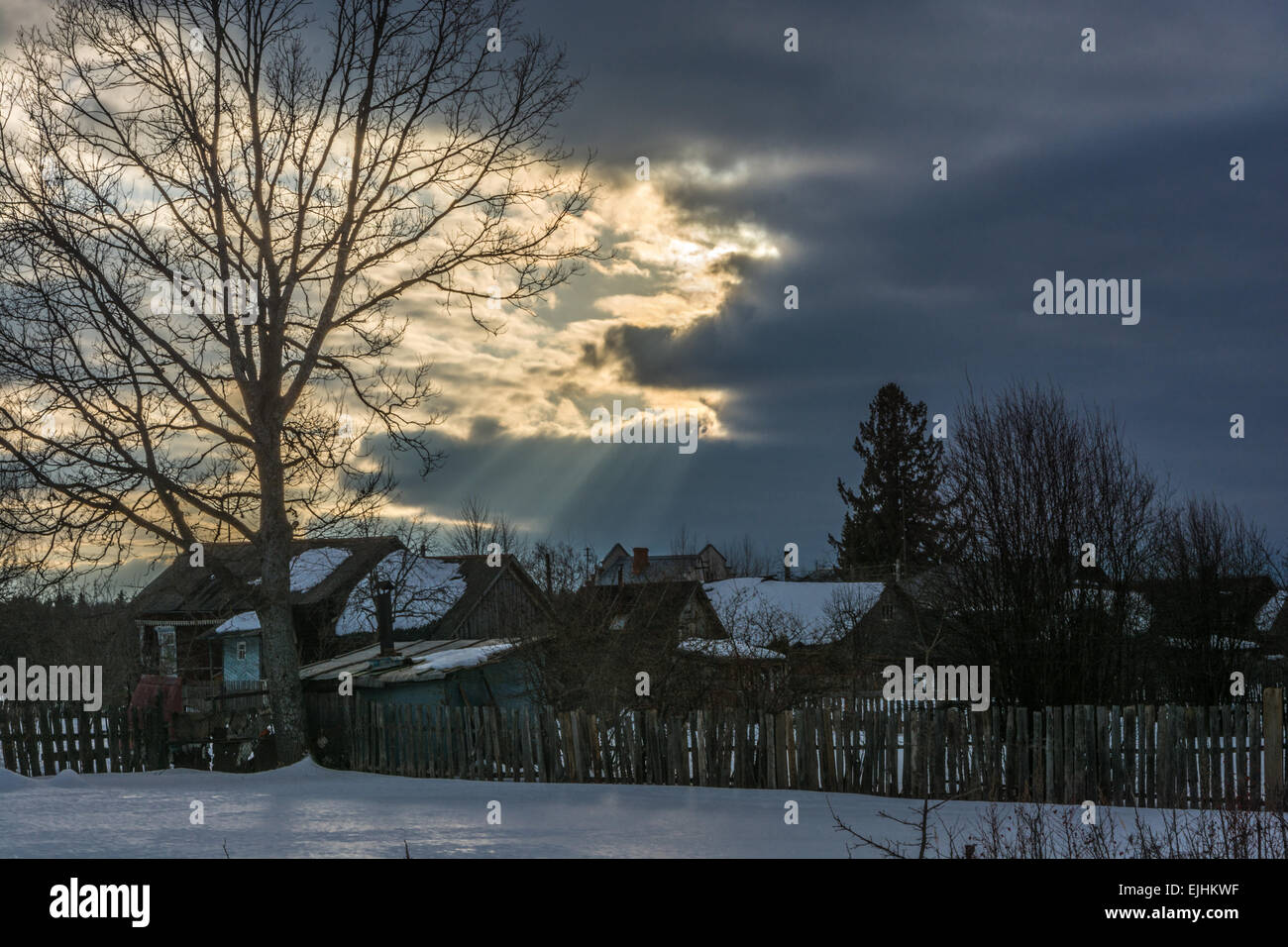 Rural landscape in March. Sun breaking through the dark cloud Stock ...