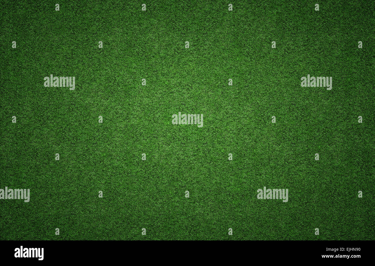 Green grass background texture with grunge lighting and lots of copy ...