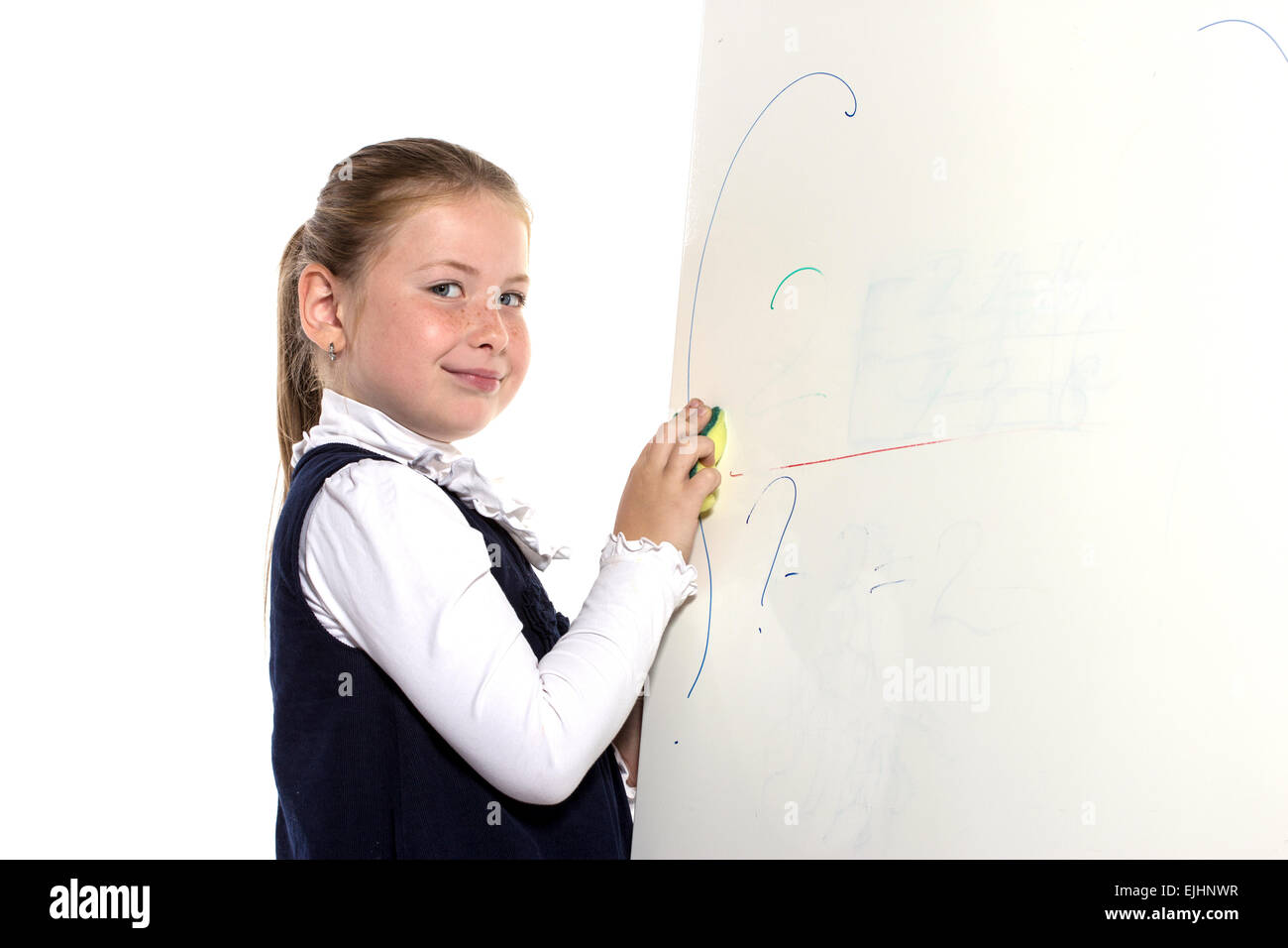 School girl erases from a board Stock Photo - Alamy