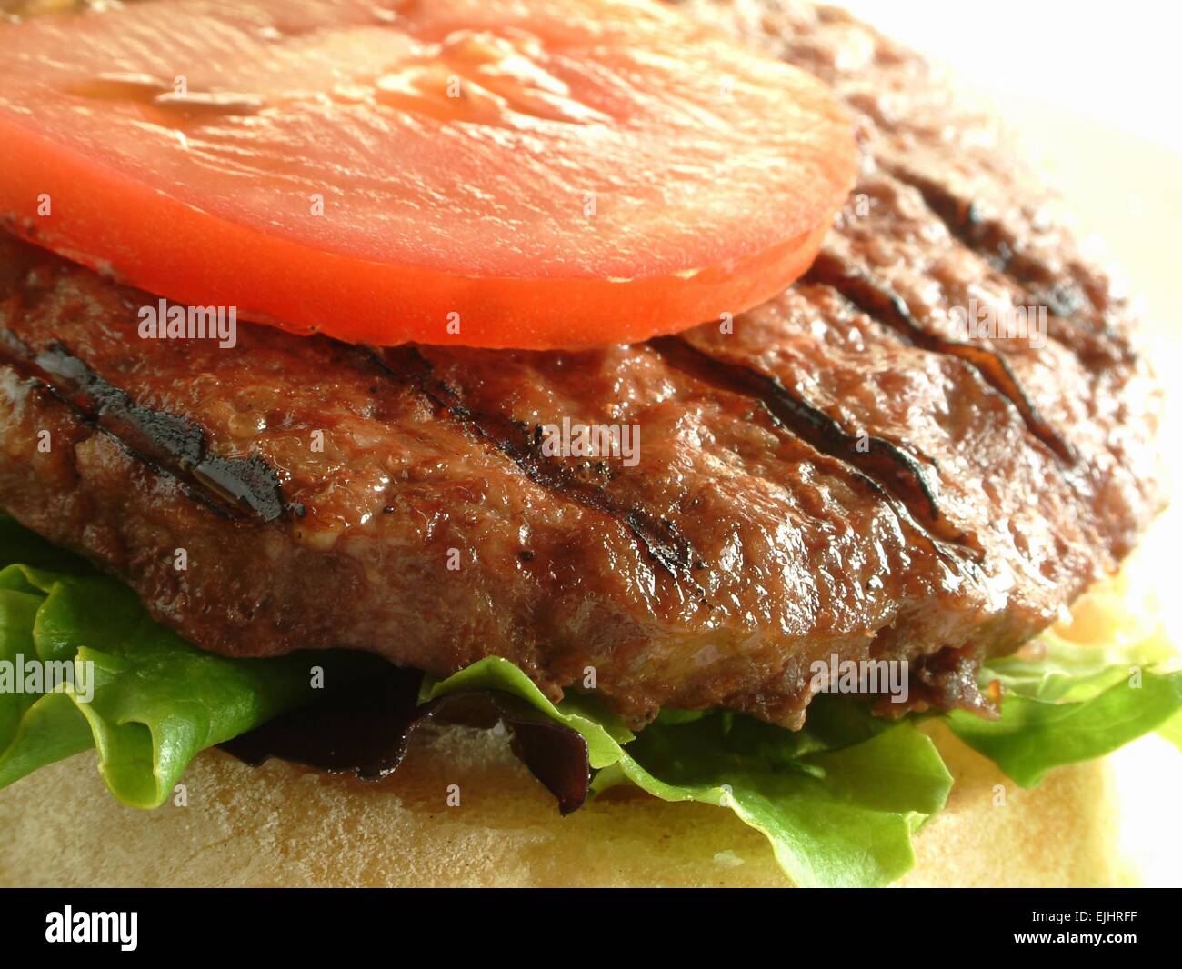 burgers cooking on barbecue Stock Photo - Alamy
