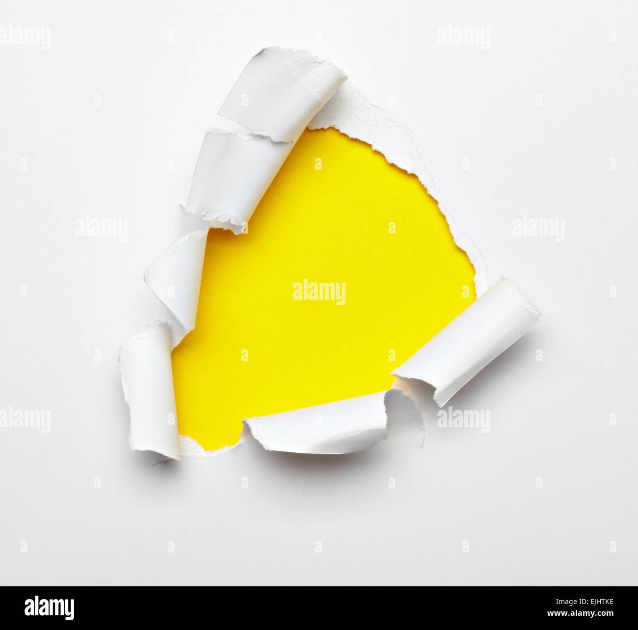 close up of a ripped paper hole on white background Stock Photo - Alamy