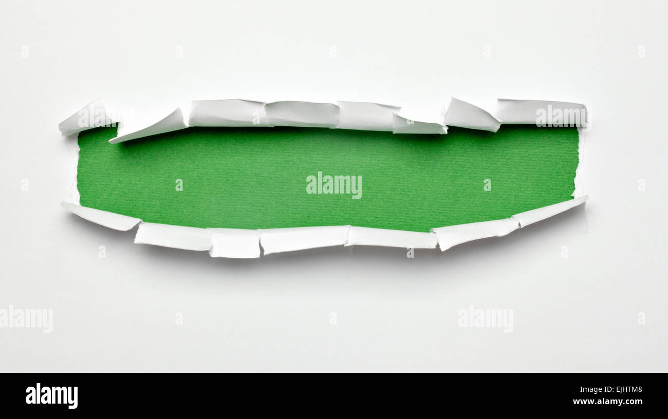 close up of a ripped paper hole on white background Stock Photo - Alamy