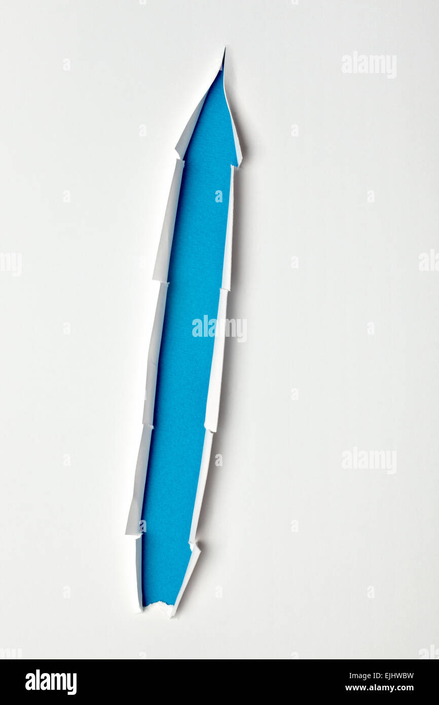 close up of a ripped paper hole on white background Stock Photo - Alamy