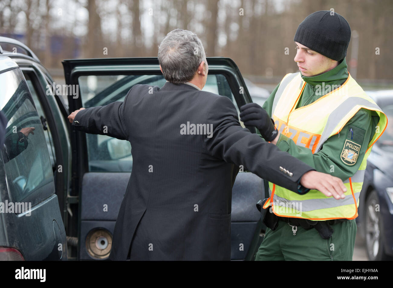 Patting down police hi-res stock photography and images - Alamy