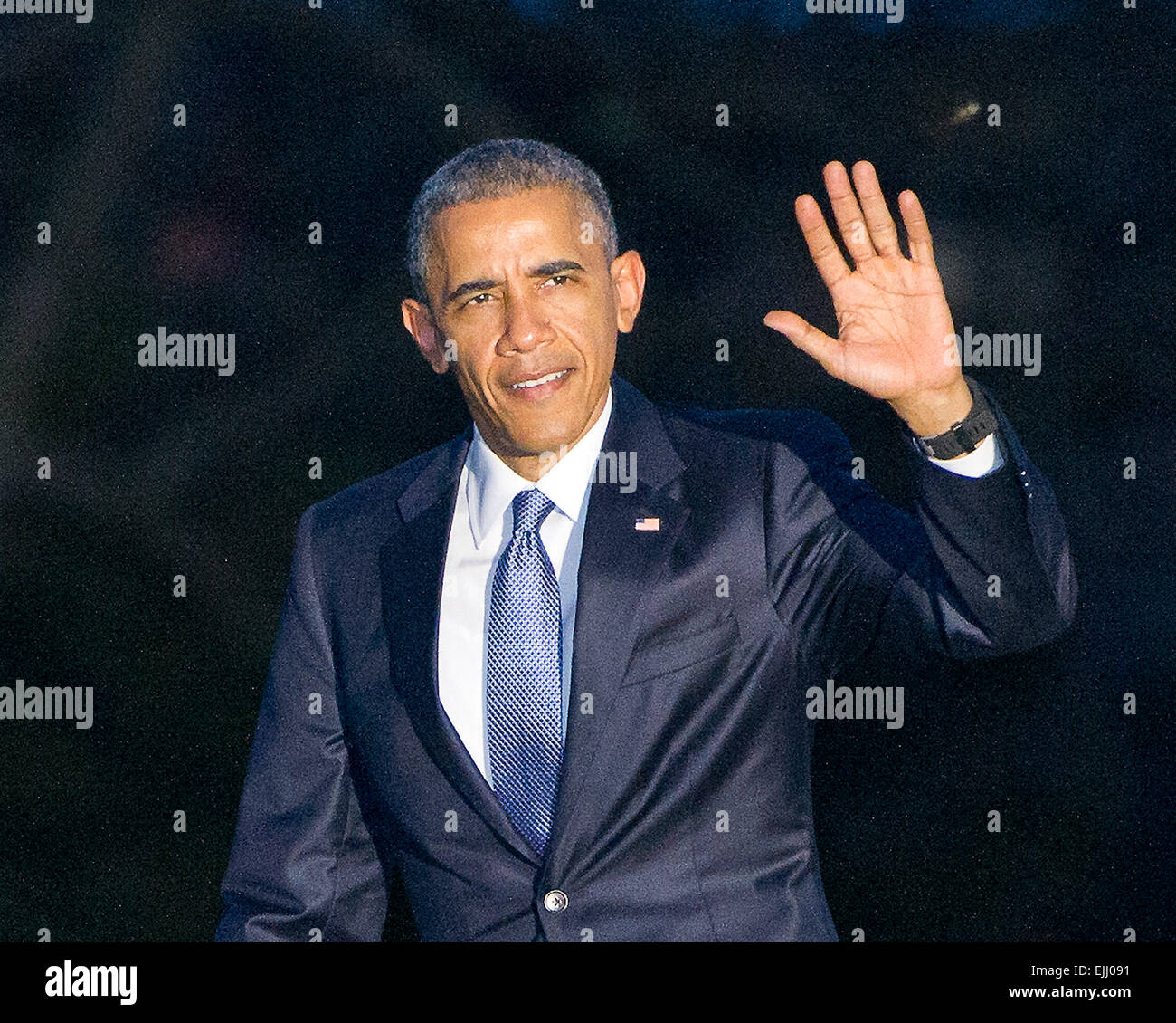 United States President Barack Obama waves to the photographers as he ...
