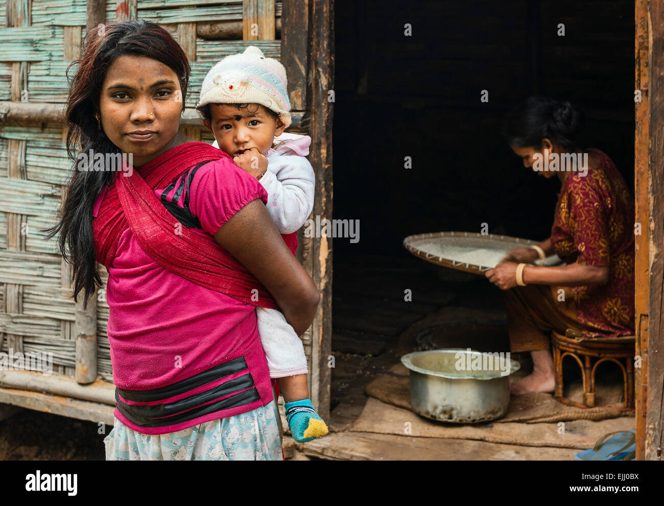 Itinerant construction workers, grandmother, mother, and baby prepare ...