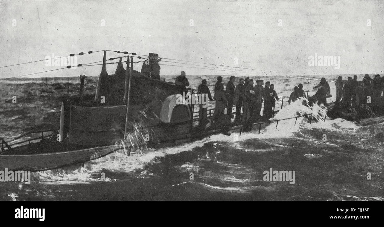 A German Submarine surrendering to the Anerican Destroyer USS Fanning ...