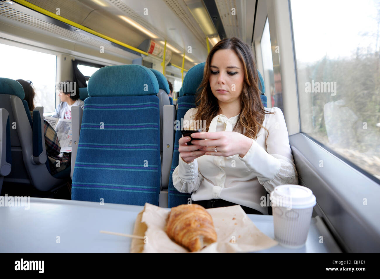 Young woman passenger on a Southern Rail train from Brighton to London ...