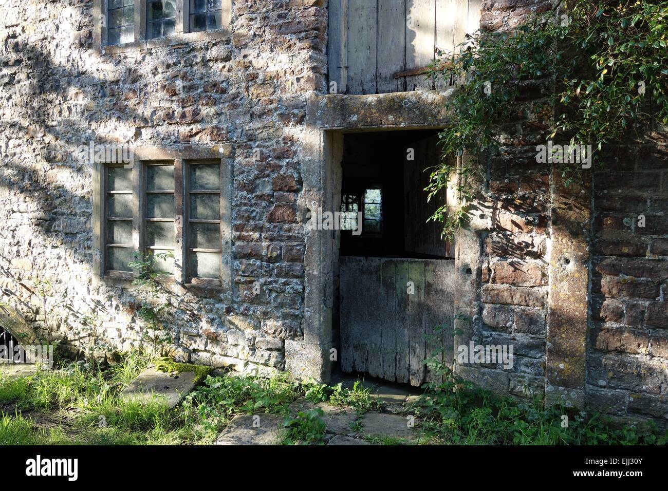 Somerset watermill, Cutterne. showing barn type door, random rubble ...
