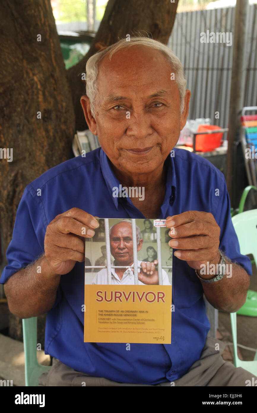 Chum Mey a survivor of the Tour Sleng Prison seen with his book ...