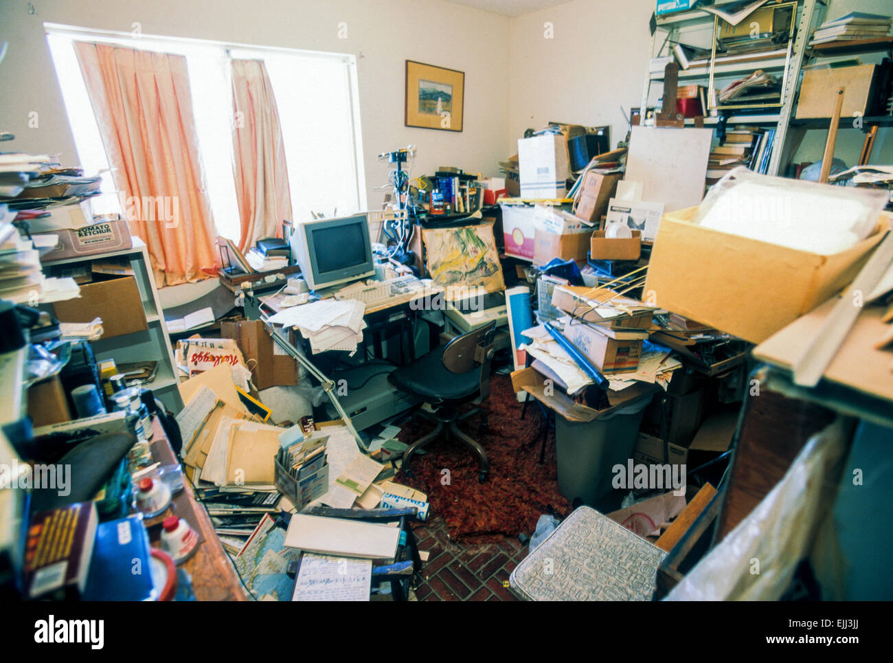 LOS ANGELES, CA – OCTOBER 1: People surrounded with clutter in their ...