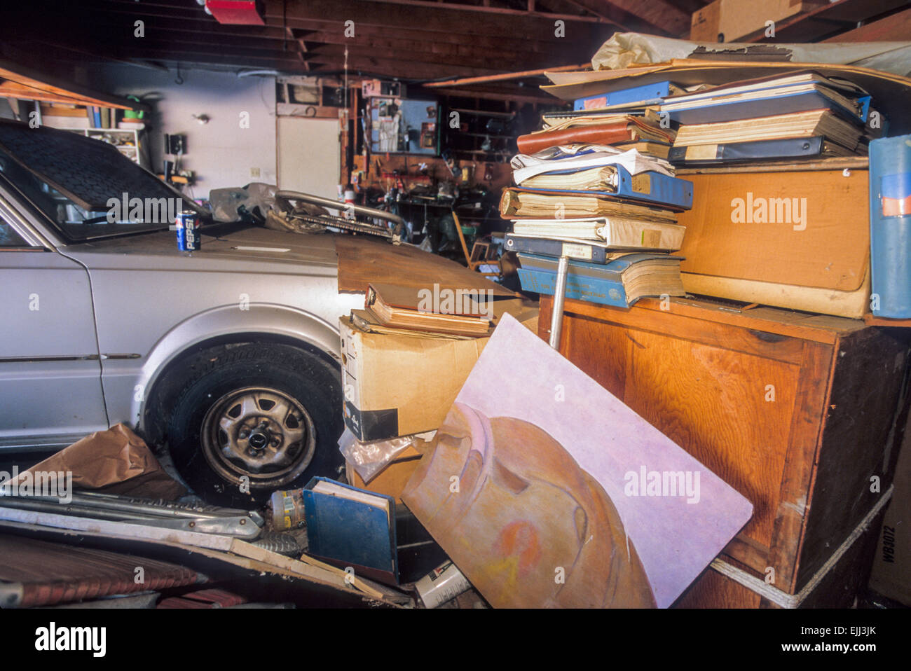 LOS ANGELES, CA – OCTOBER 1: People surrounded with clutter in their ...