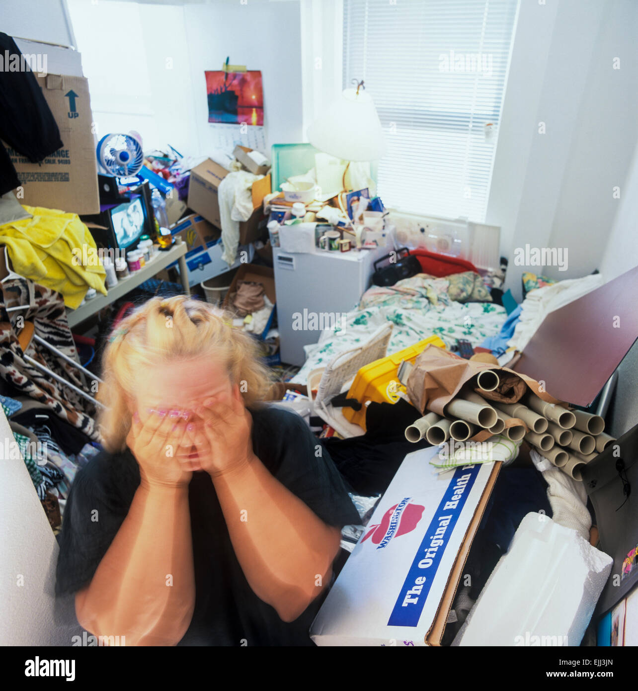 LOS ANGELES, CA – OCTOBER 1: People surrounded with clutter in their ...