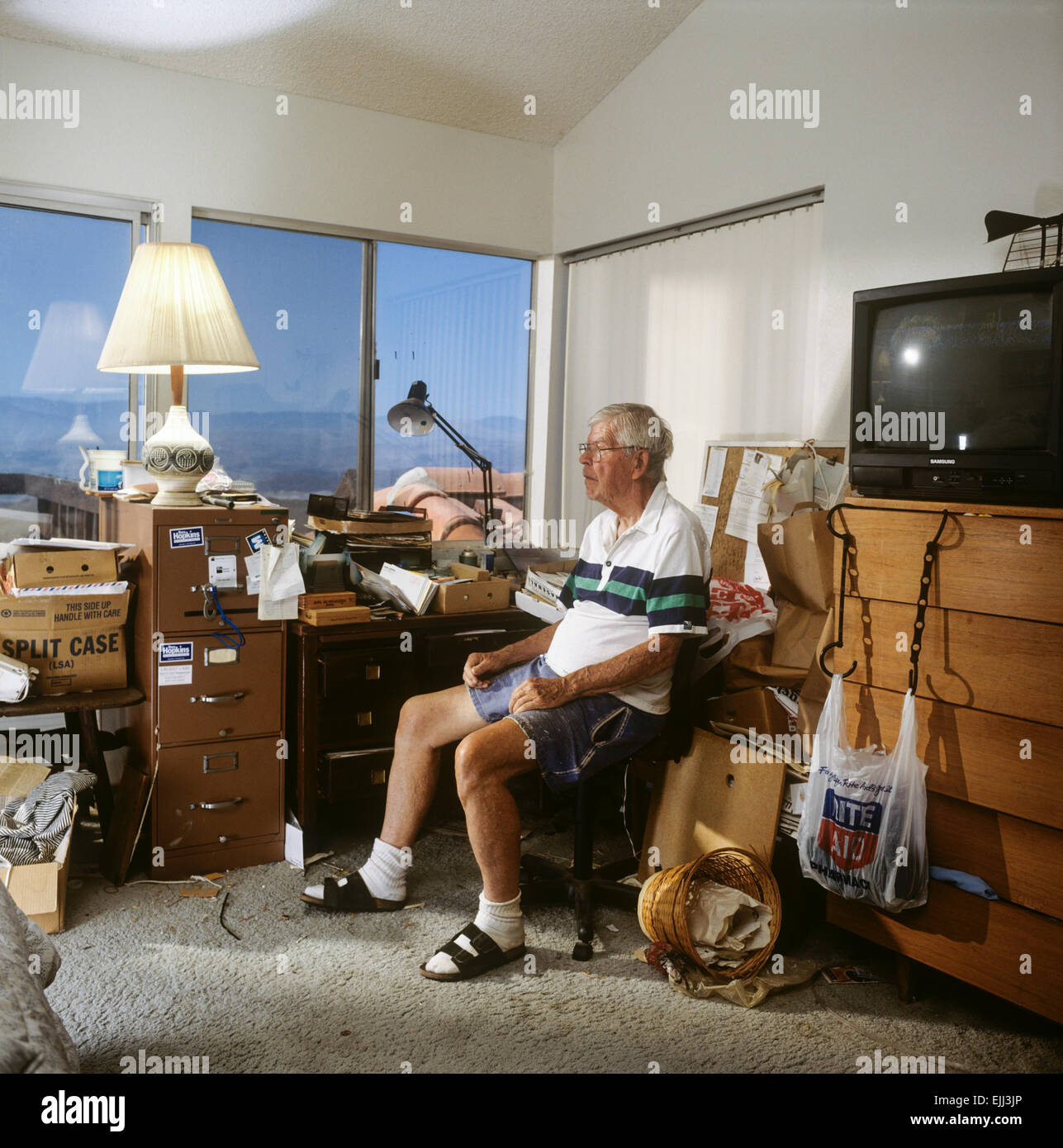 LOS ANGELES, CA – OCTOBER 1: People surrounded with clutter in their ...