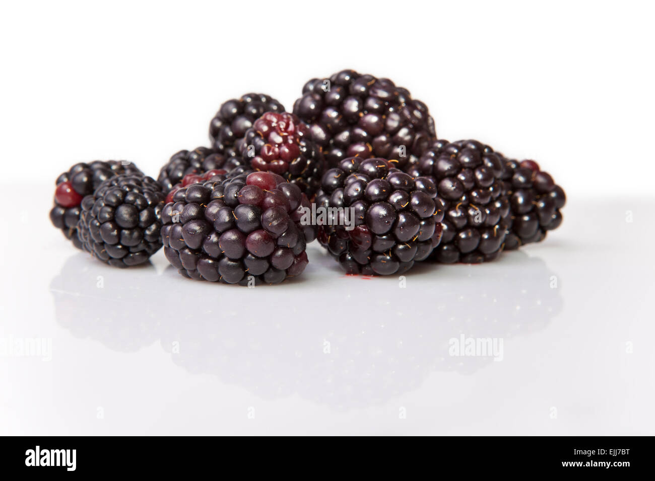 Bunch of fresh ripe blackberries. Isolated over on white background ...