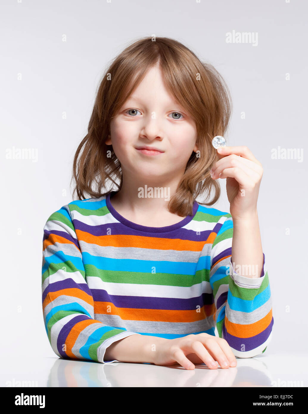 Child holding a coin hi-res stock photography and images - Alamy