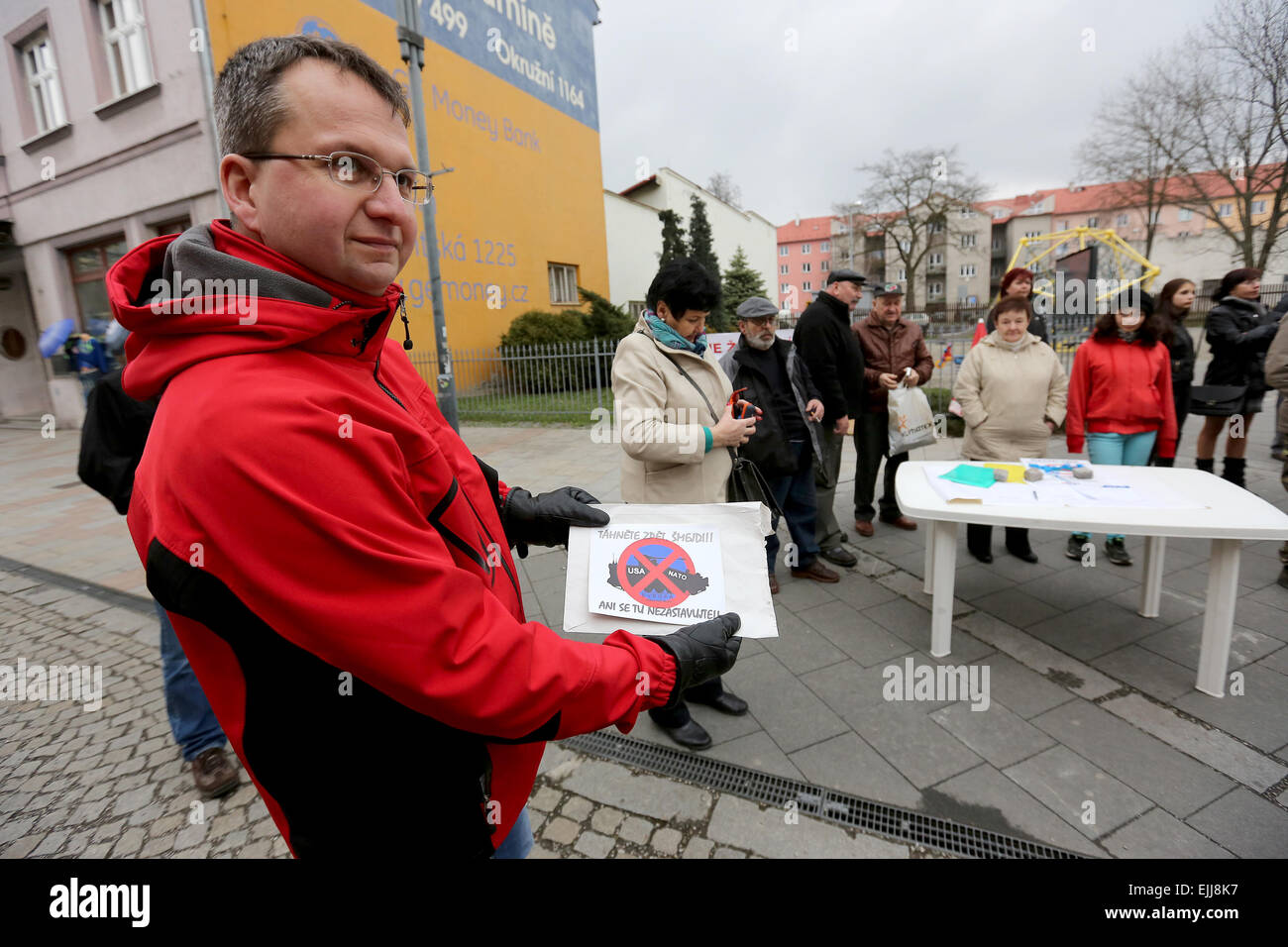 Bohumin, Czech Republic. 27th Mar, 2015. Man shows antiwar poster ...
