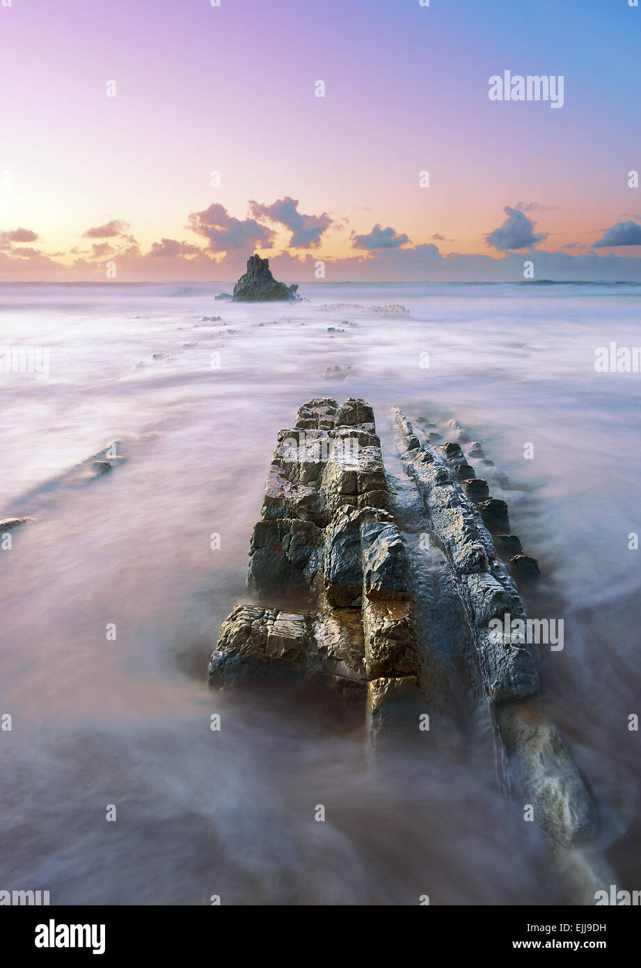 rocks with silky water in Sopelana beach Stock Photo - Alamy