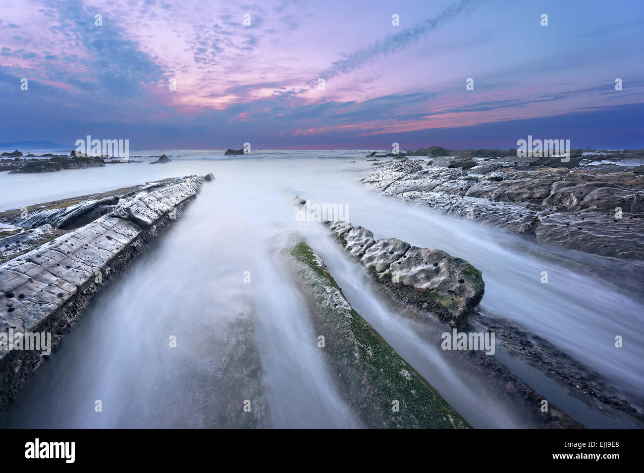 rocks in Barrika beach at the sunset Stock Photo - Alamy
