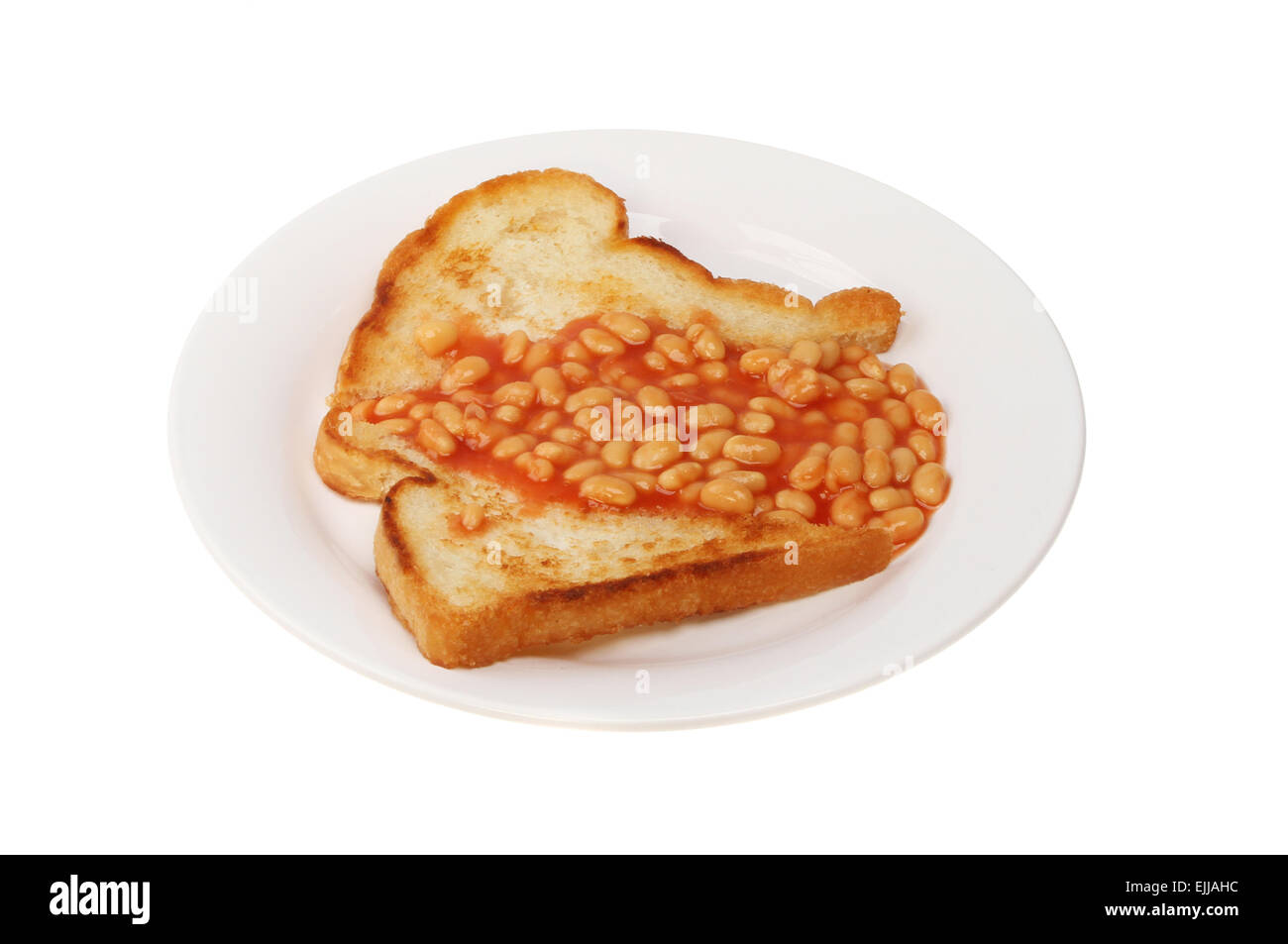 Baked beans and fried bread on a plate isolated against white Stock ...
