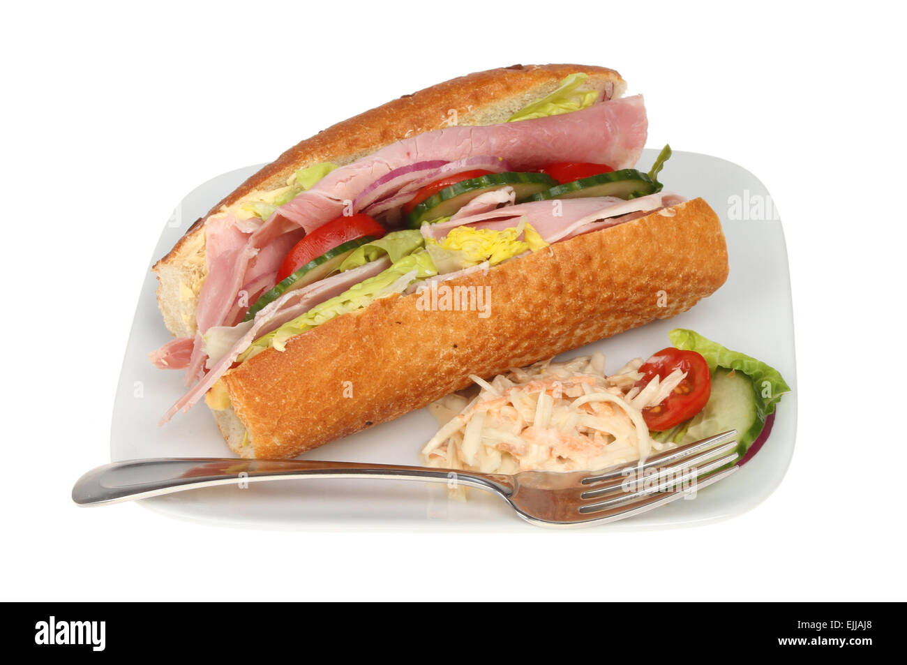 Ham salad roll with coleslaw, salad garnish and a fork on a plate ...