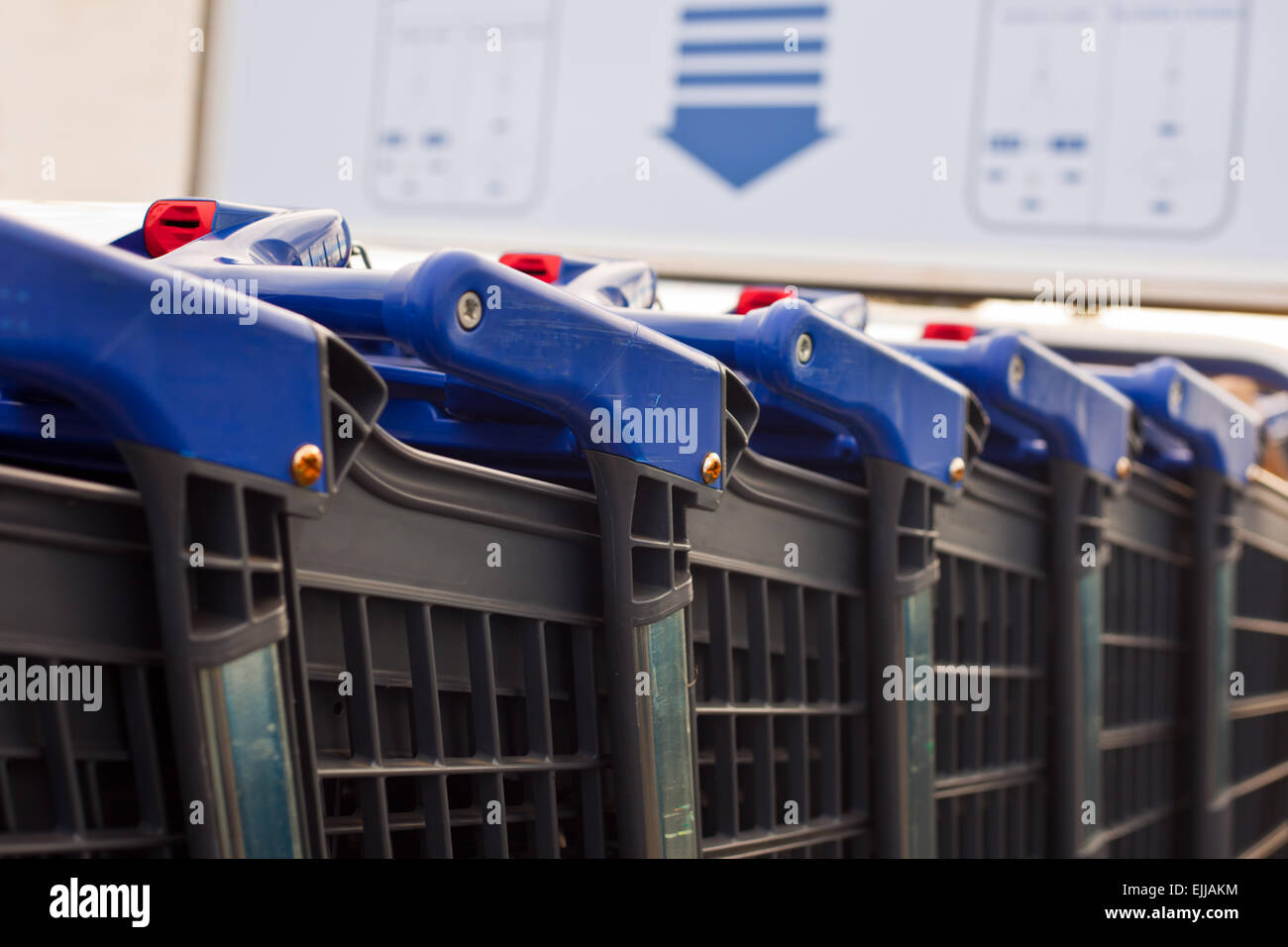Blue shopping carts on a parking lot outdoors the mall Stock Photo - Alamy