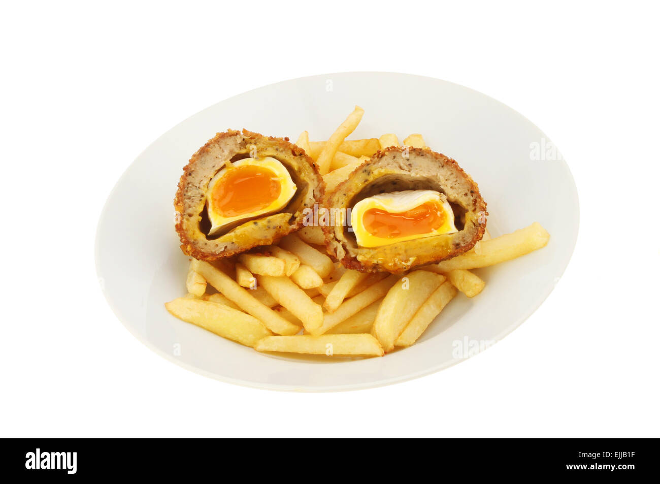 Runny yolk scotch egg and chips in a bowl isolated against white Stock ...