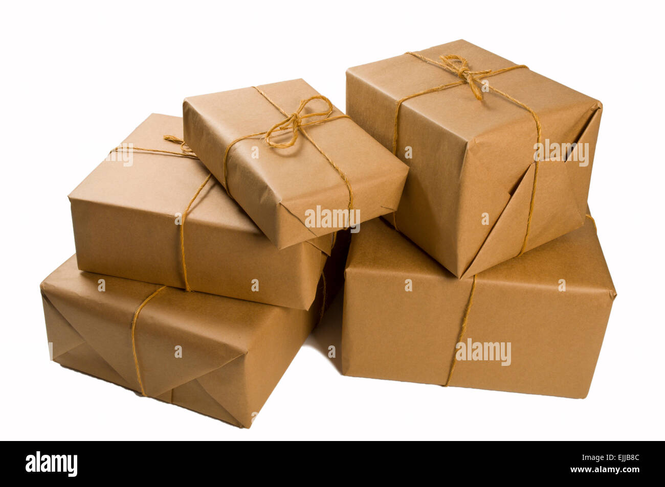 Stack of brown paper wrapped parcels for shipping Stock Photo - Alamy