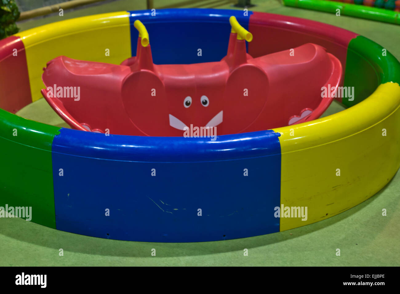 Plastic seesaw indoors at preschool Kindergarten colorful toys area ...