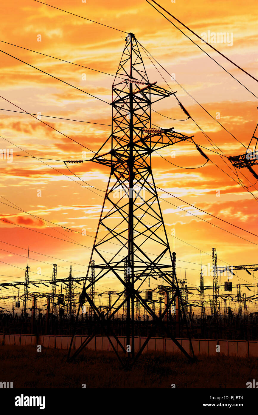 High-tension power line on sunset Stock Photo - Alamy