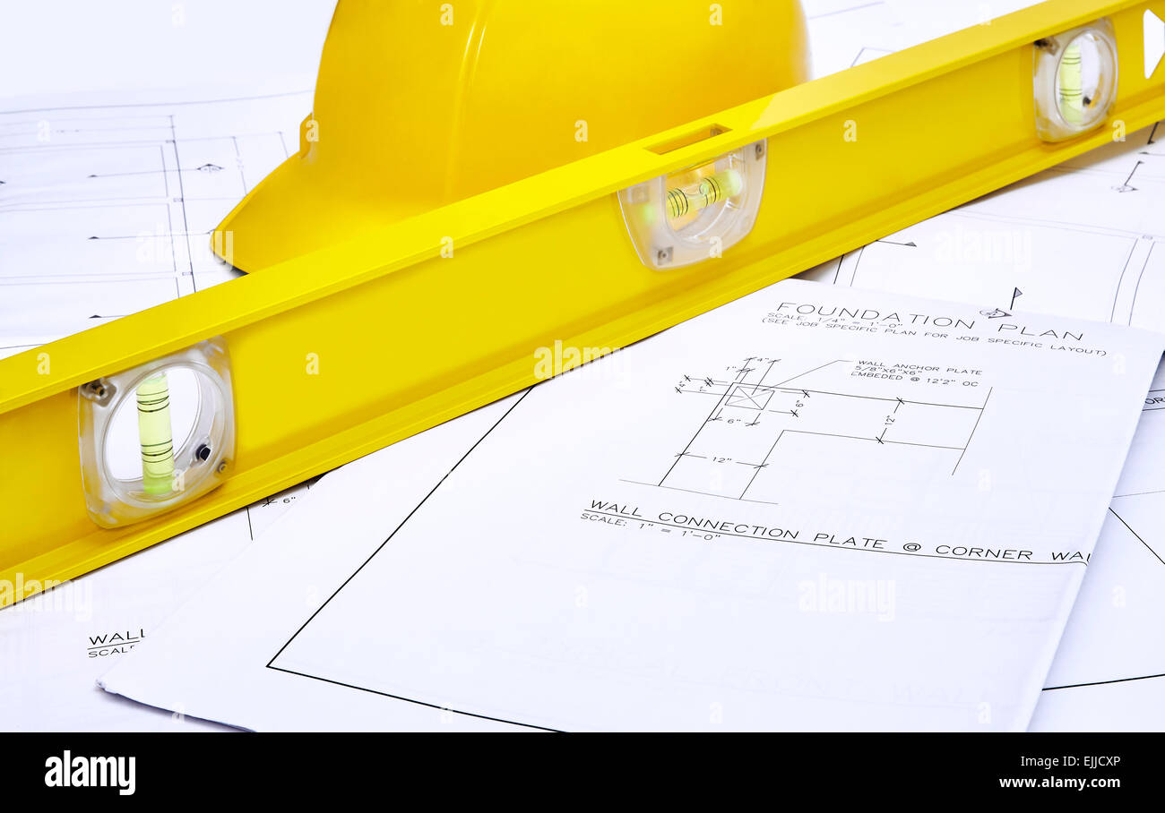 A set of blueprints with hardhat and level Stock Photo - Alamy